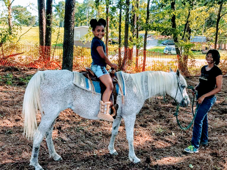 How 40 horses and a great cowgirl are helping young readers